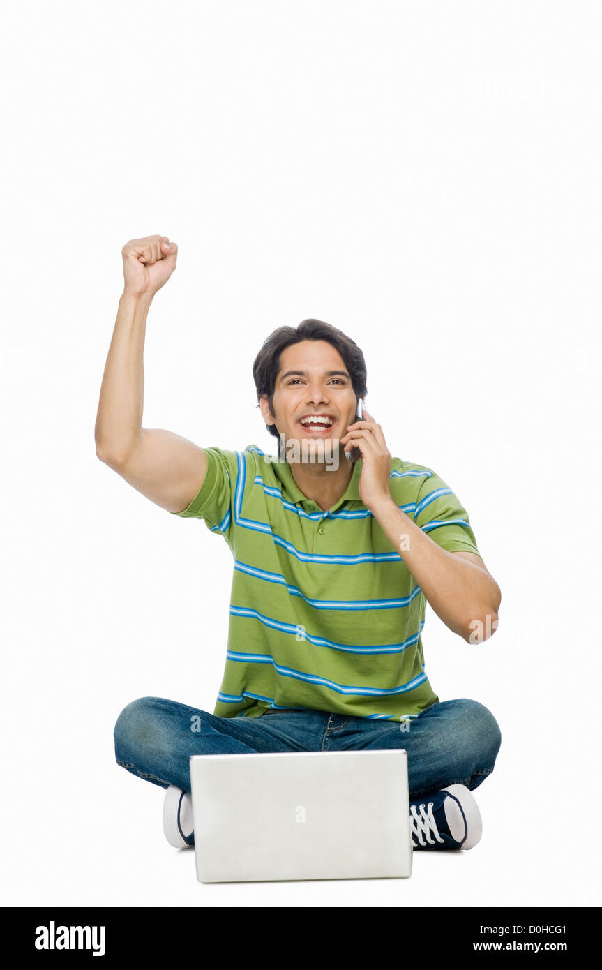 Cheerful guy using mobile Cut Out Stock Images & Pictures - Alamy