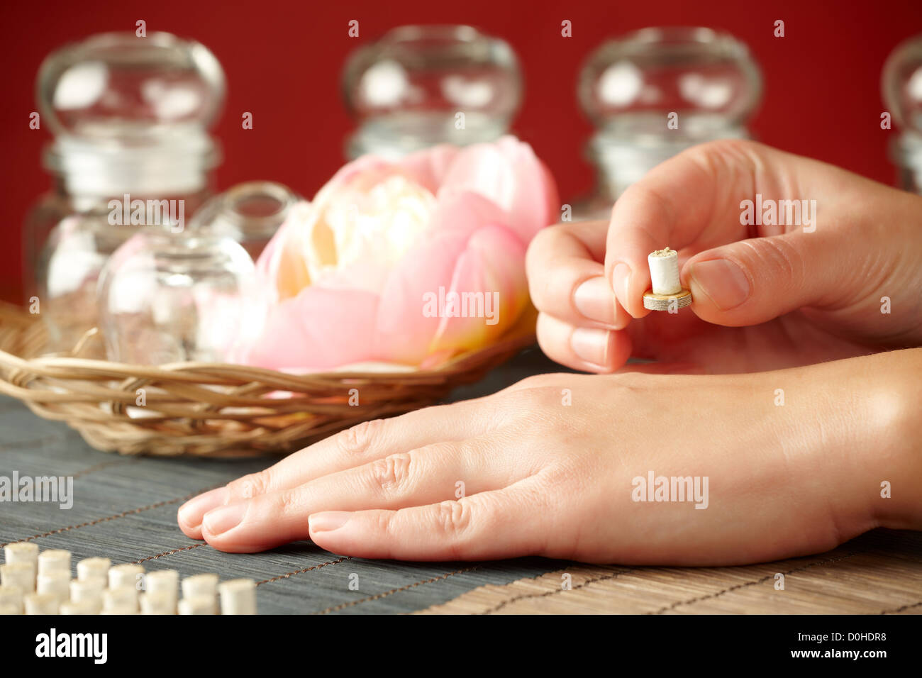 TCM Traditional Chinese Medicine. Hand applying mini moxa stick therapy ...