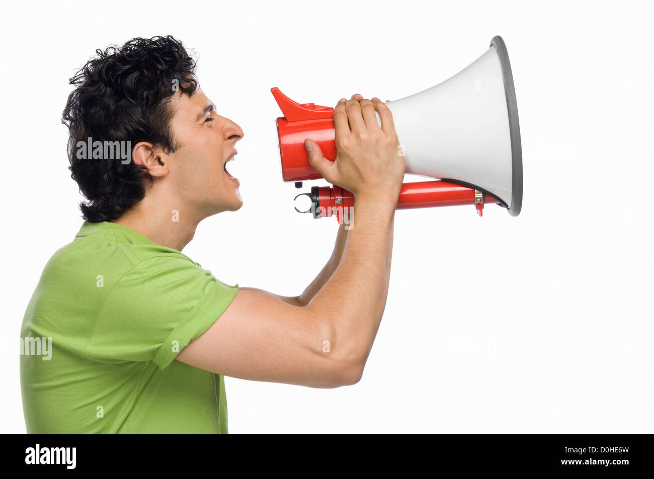 Man holding a megaphone and shouting Stock Photo - Alamy