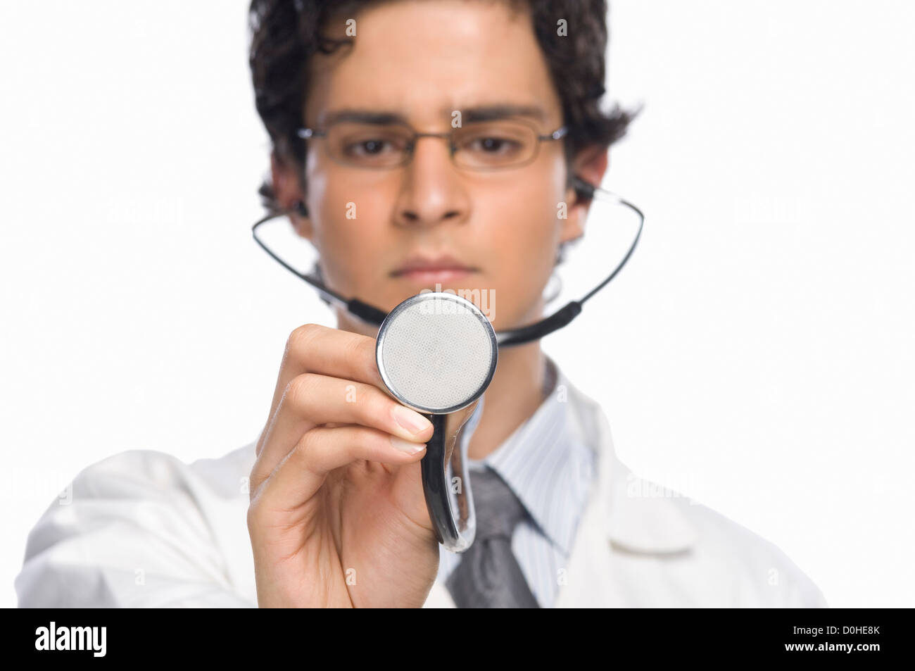 Male doctor holding a stethoscope Stock Photo - Alamy