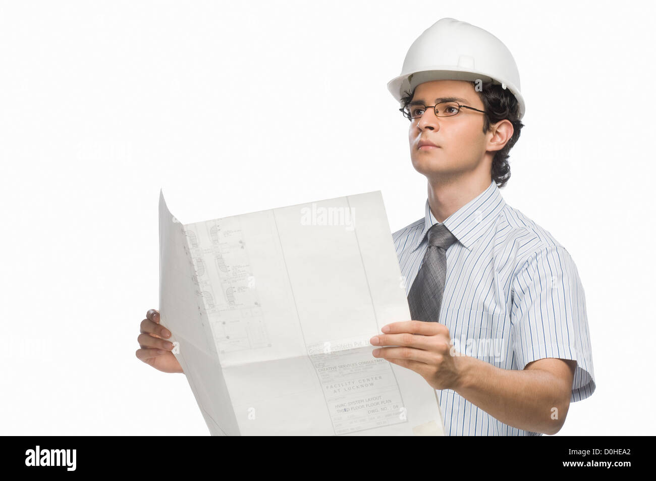Male architect holding a blueprint Stock Photo - Alamy