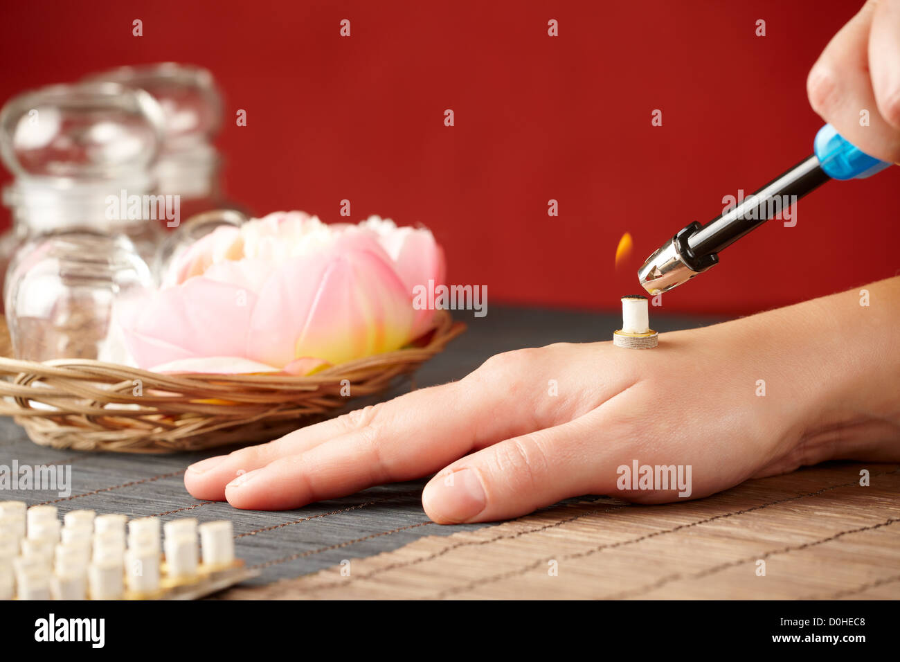 TCM Traditional Chinese Medicine. Hand lighting mini moxa stick, flower ...