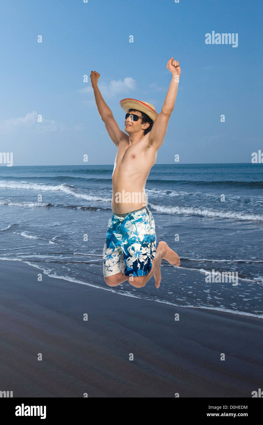 Man jumping on the beach Stock Photo - Alamy