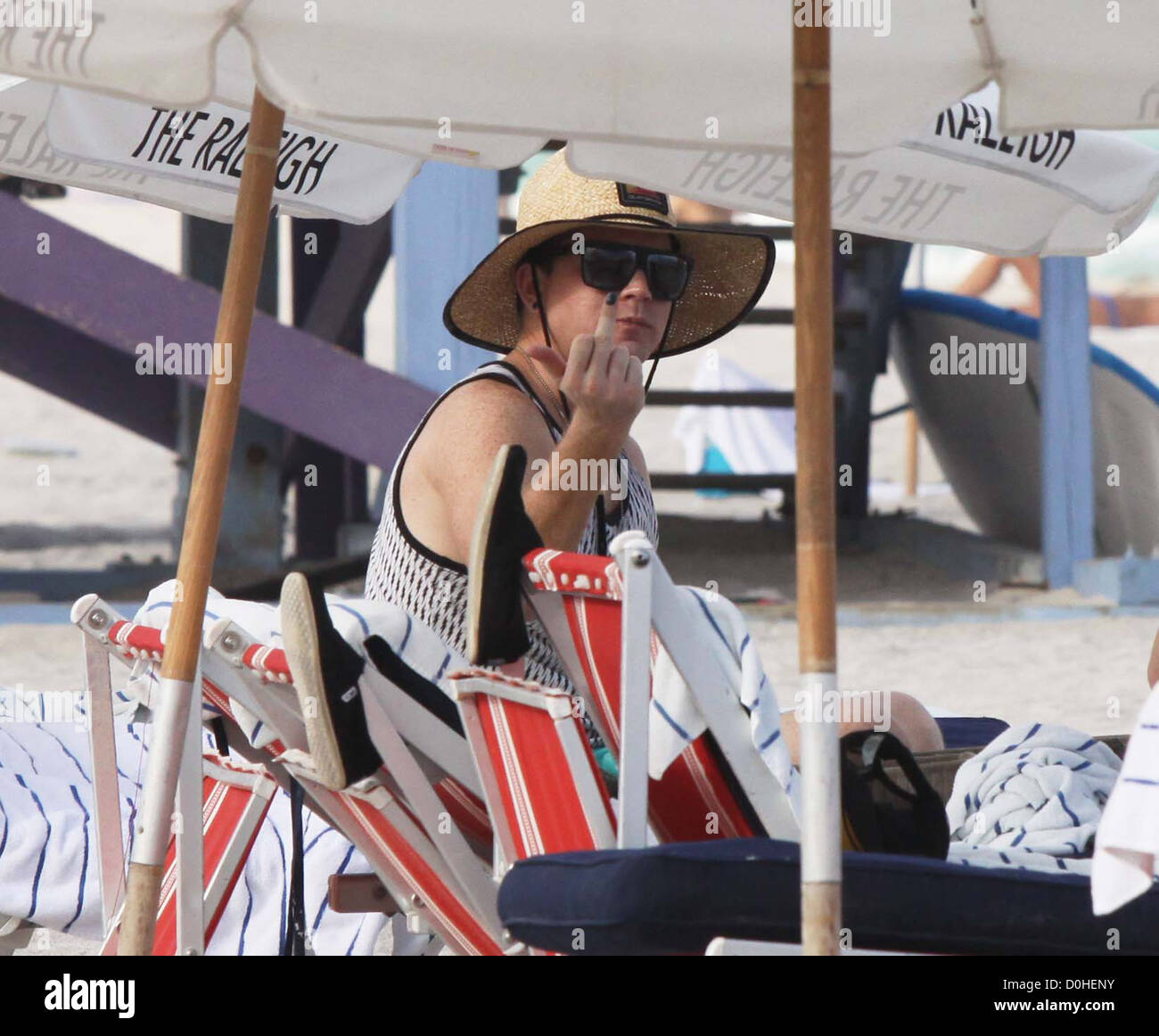 American Idol runner-up Adam Lambert raises his middle finger to a ...