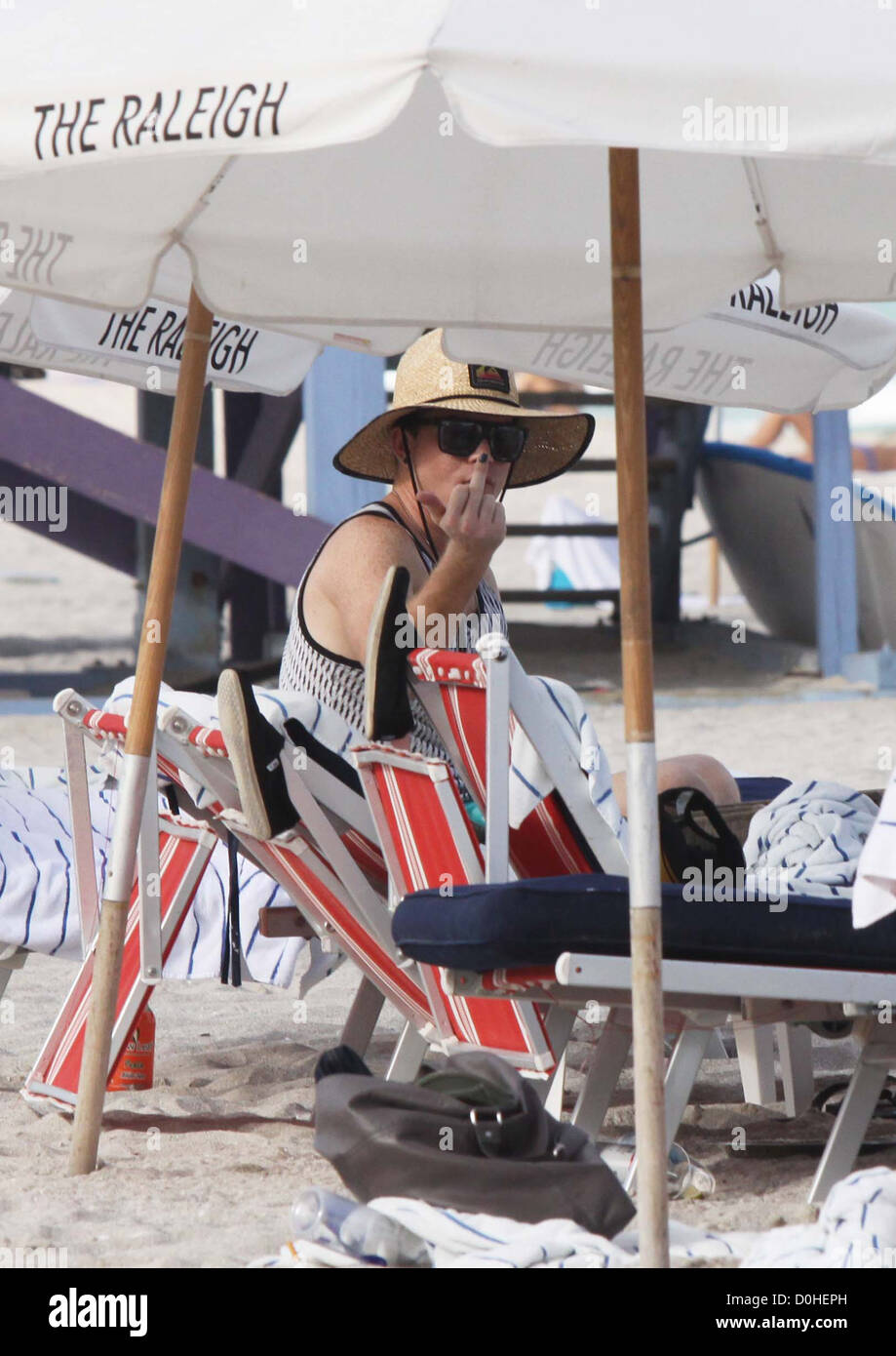 American Idol runner-up Adam Lambert raises his middle finger to a ...