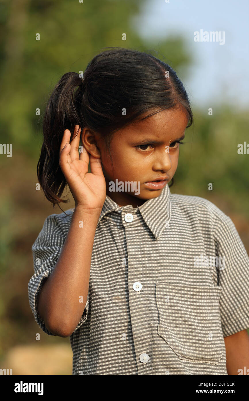 Indian girl cupping her ear to improve hearing Andhra Pradesh South ...