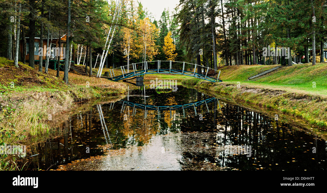 Bridge over river in autumn nice reflection Stock Photo - Alamy