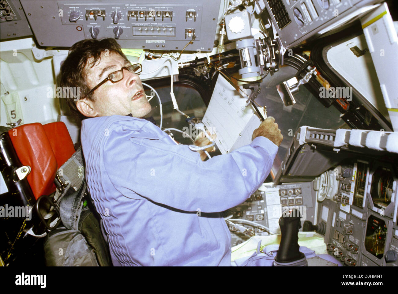 John W. Young, STS-1 mission Commander, prepares to log flight ...