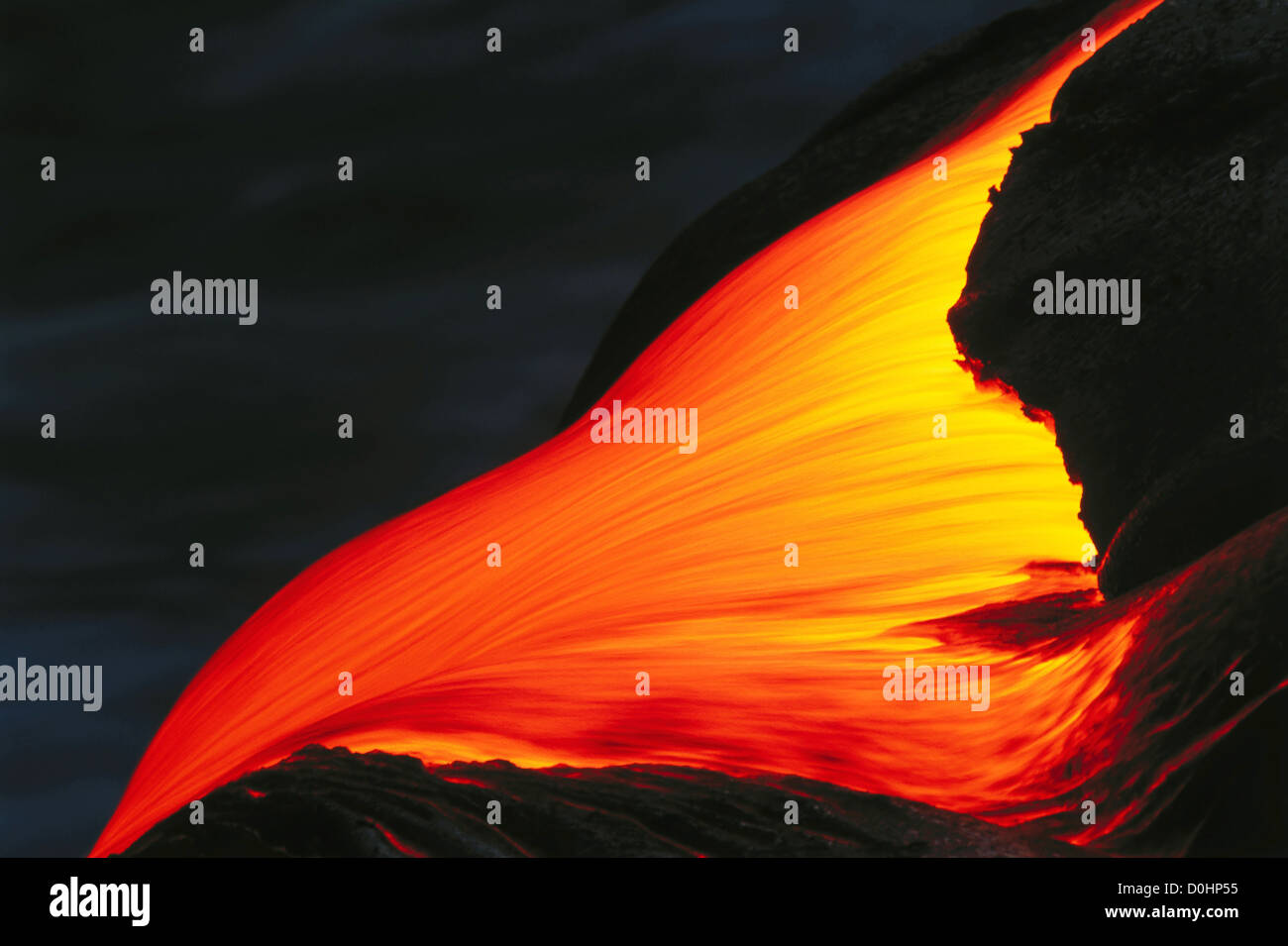 A River of Molten Pahoehoe Lava Moving Quickly Over a Ledge Stock Photo ...