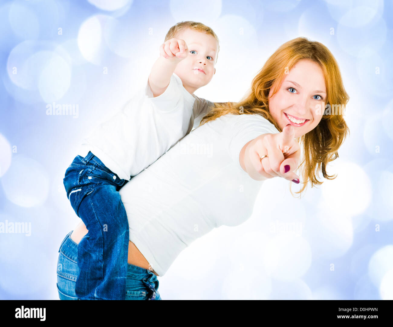 Mother and son point out with blue lights in the background Stock Photo ...