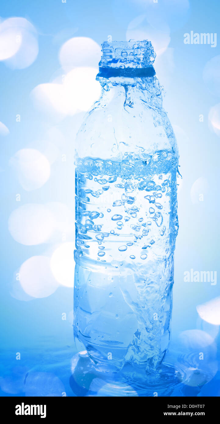 pouring water from bottle with blue lights in the background Stock ...