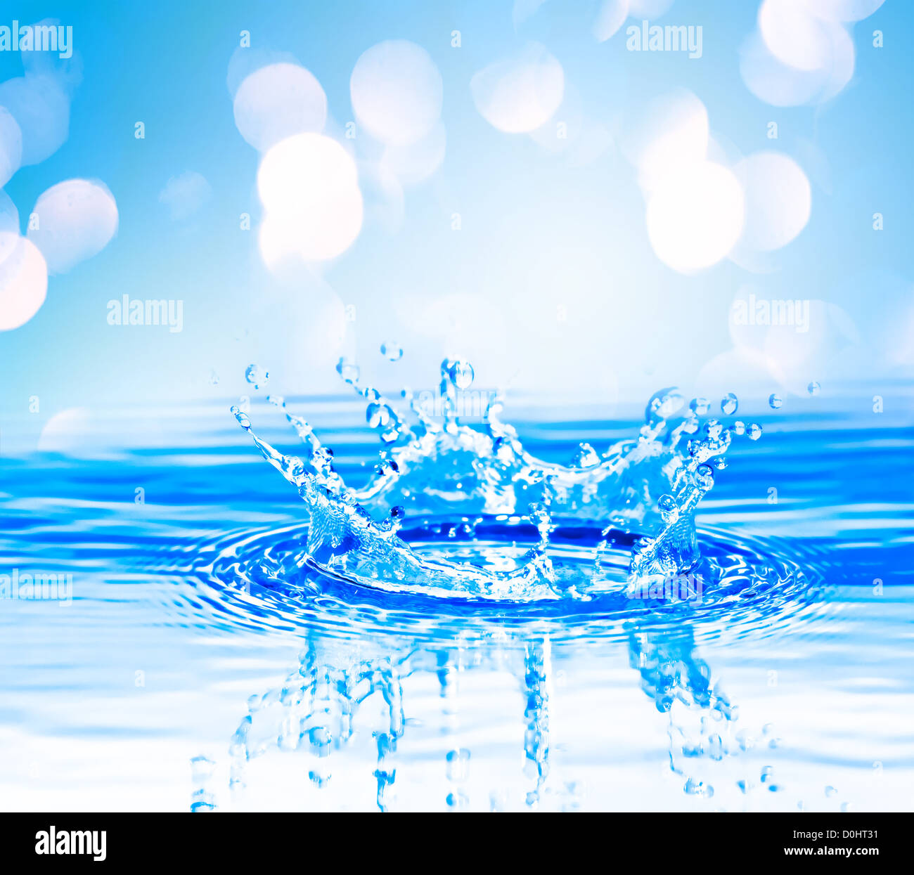 beautiful splash of water blue drops with blue lights in the background ...