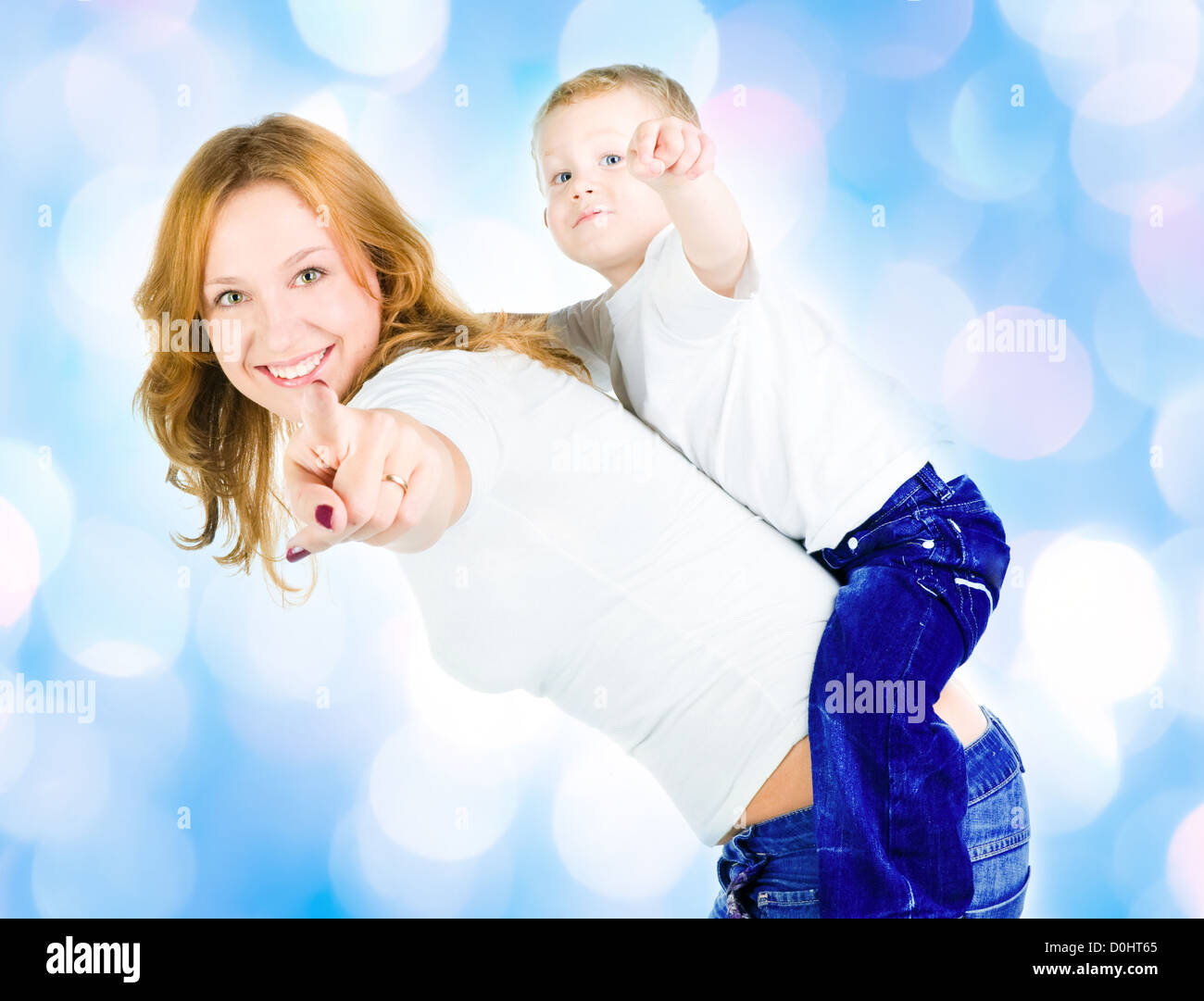 Mother and son point out with blue lights in the background Stock Photo ...