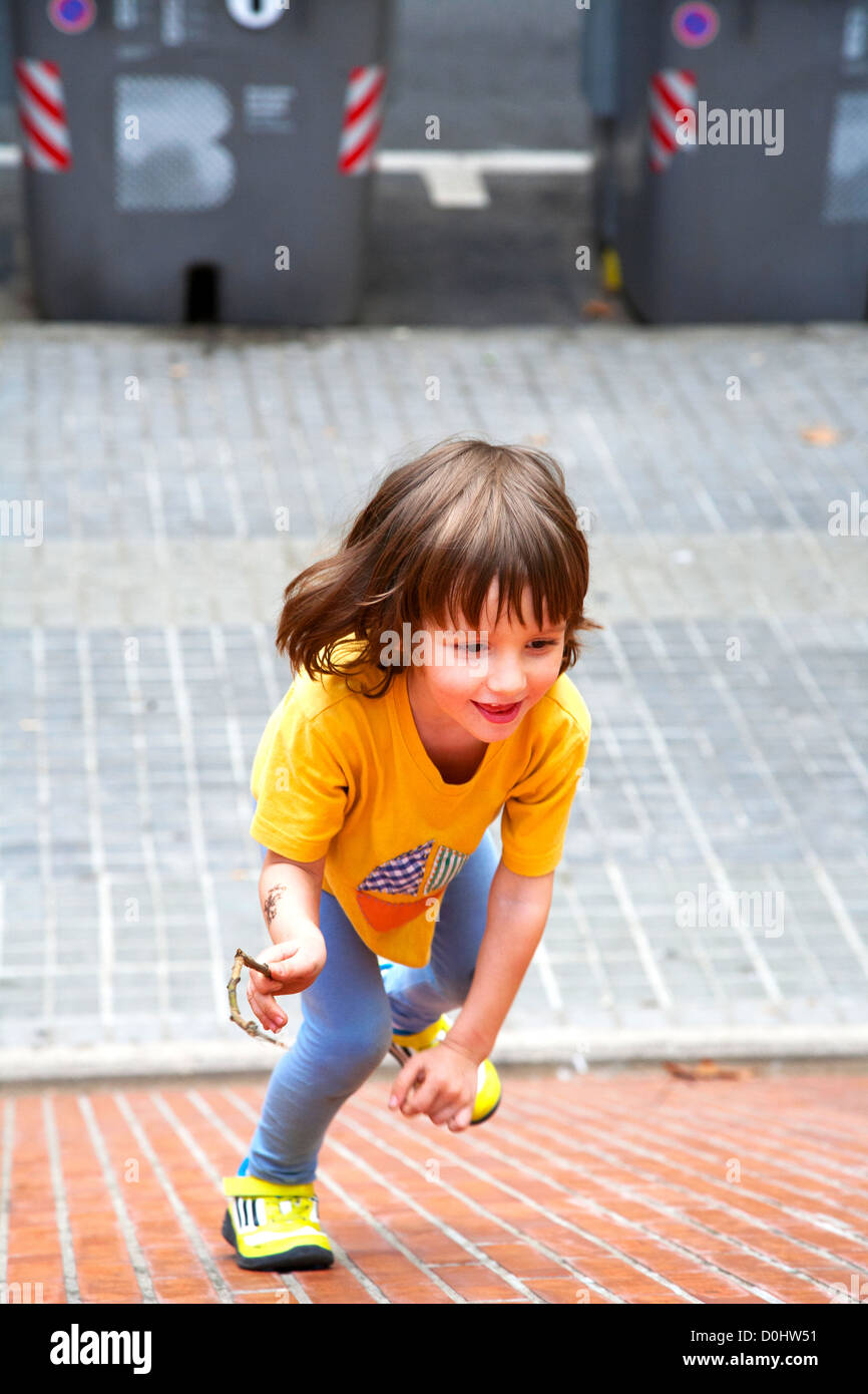 Young boy running up wall Stock Photo - Alamy