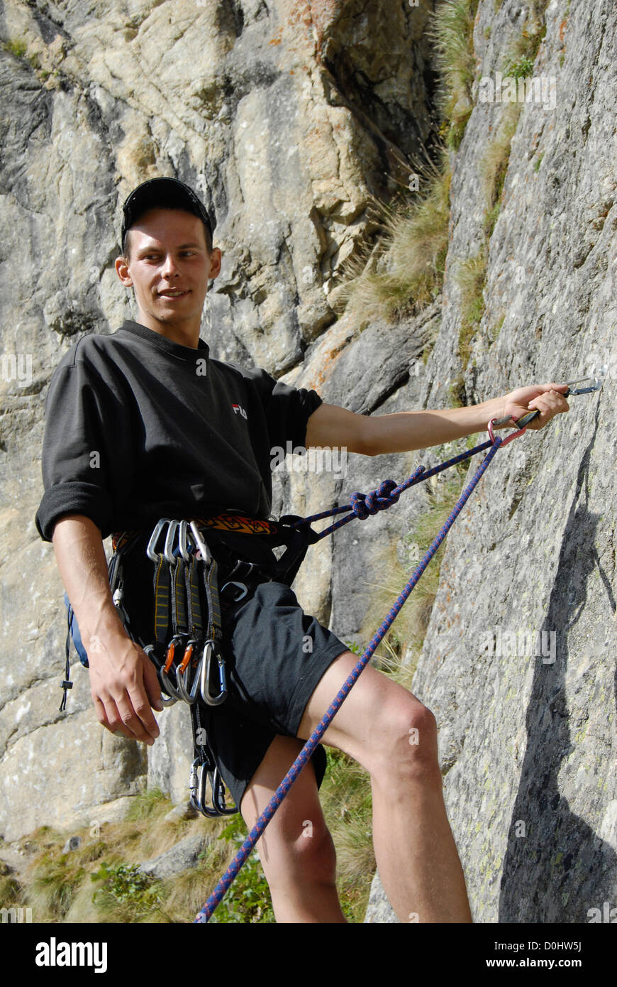 young man mountains mountaineer rope Stock Photo - Alamy