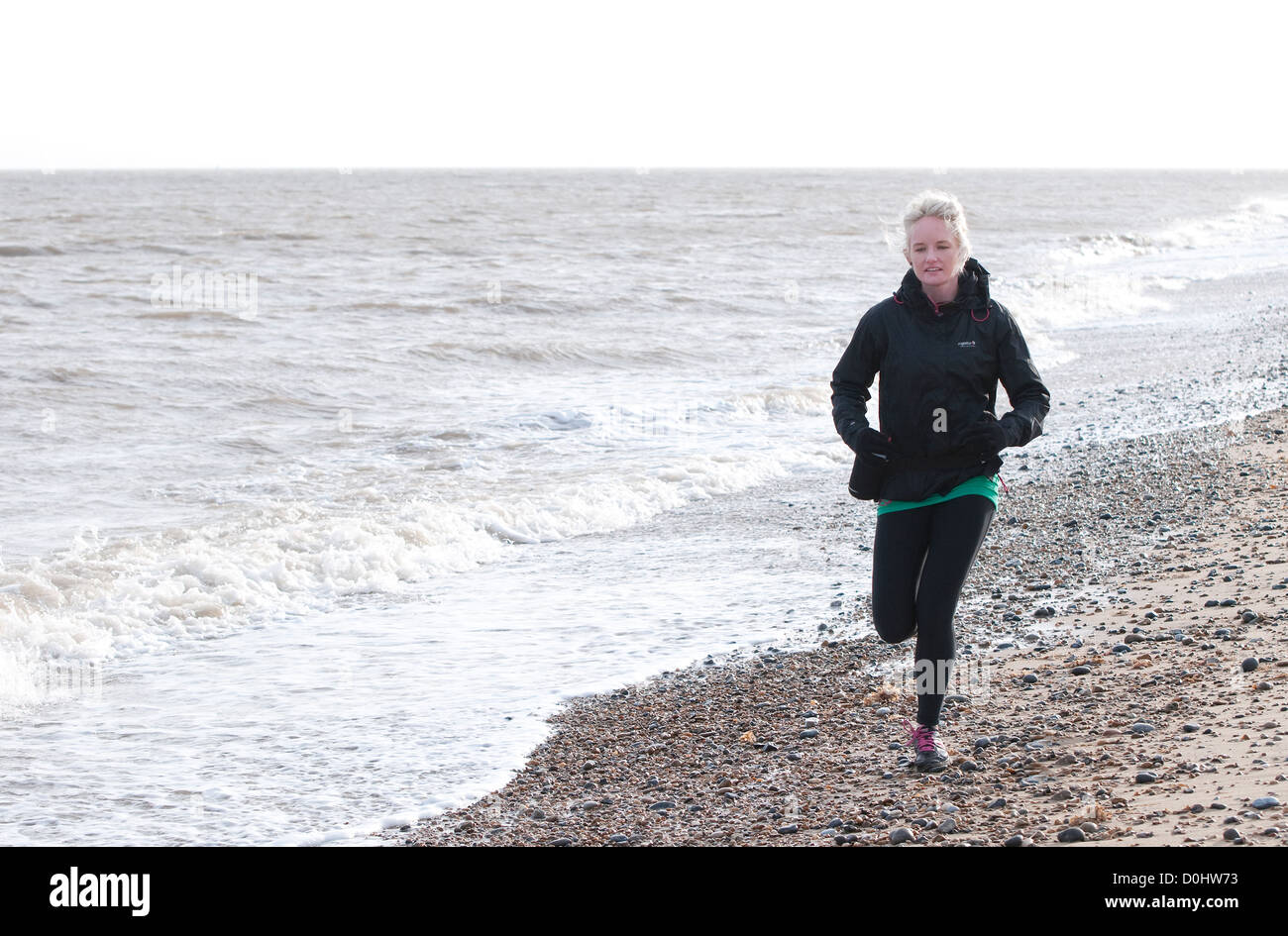 Black runner on beach uk hi-res stock photography and images - Alamy