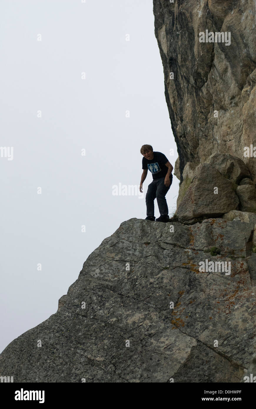 man standing edge cliff mountains Stock Photo - Alamy