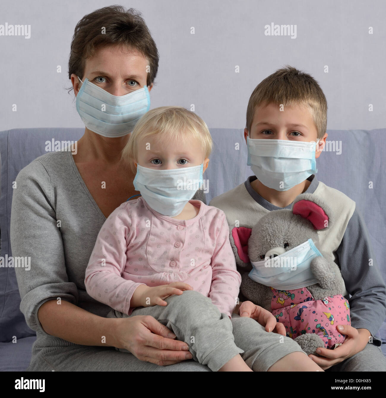 Family in protective masks Stock Photo - Alamy