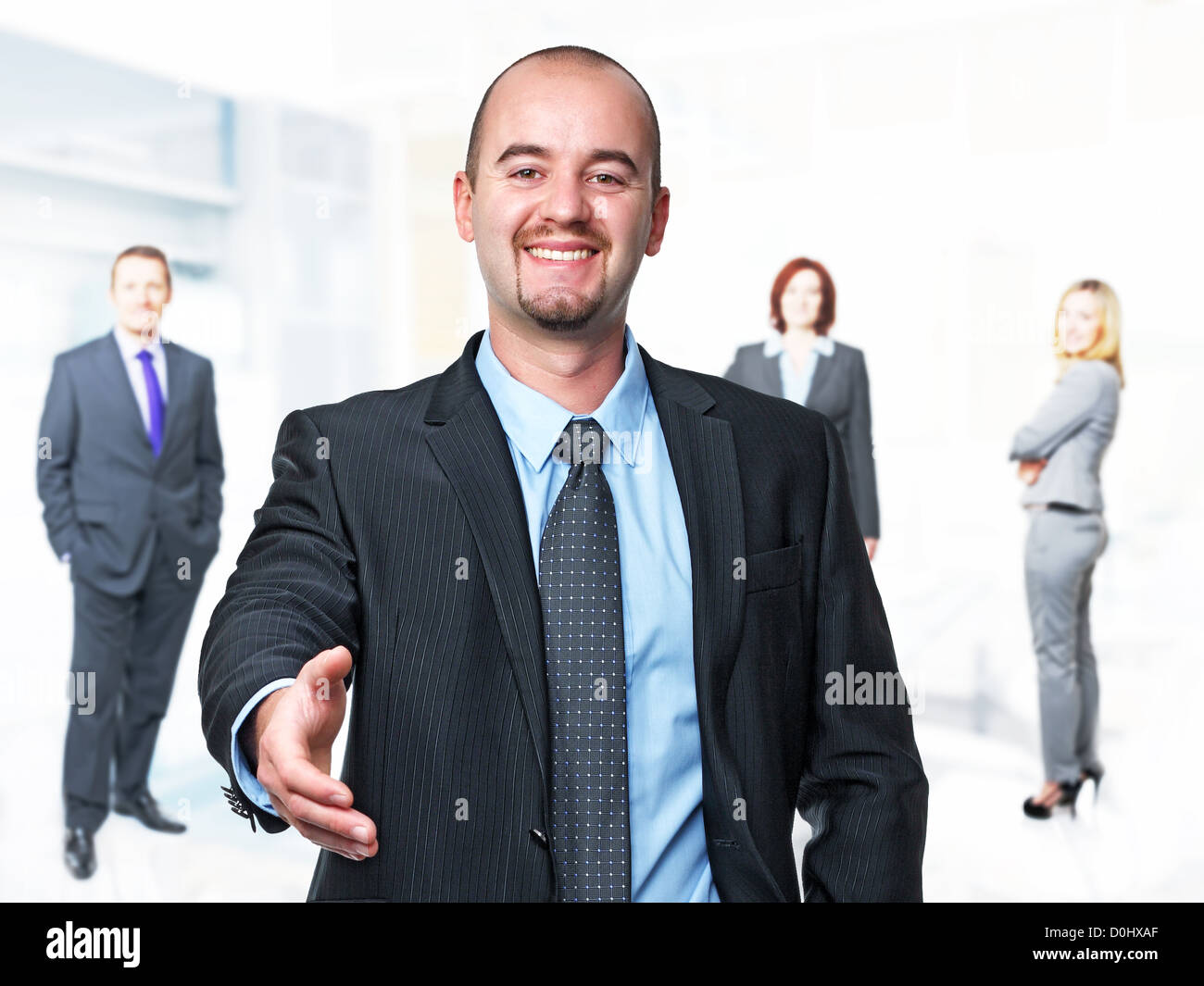 portrait of man and his work team Stock Photo - Alamy