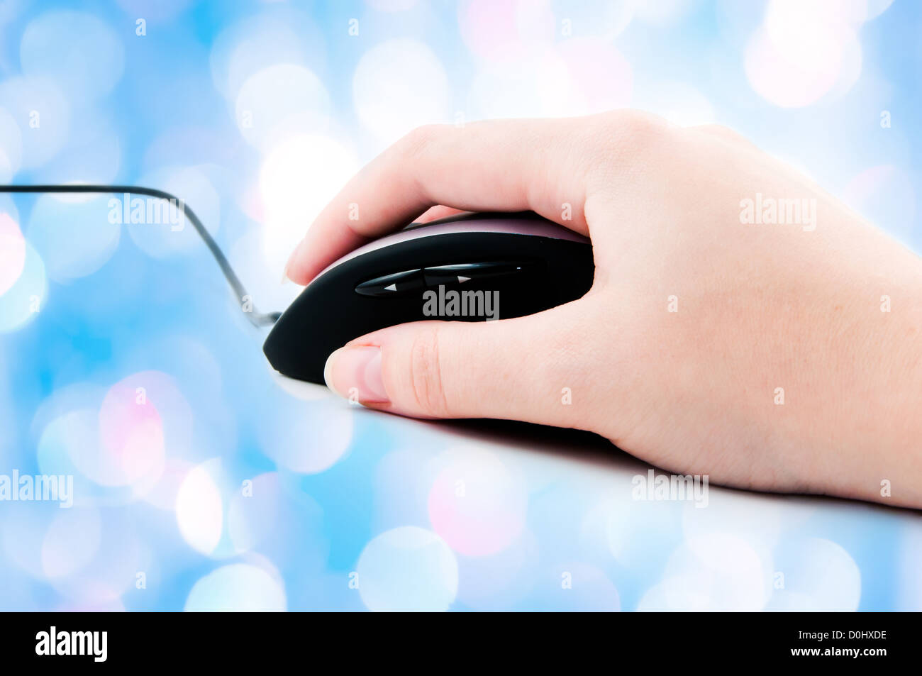 computer mouse with hand with blue lights in the background Stock Photo ...