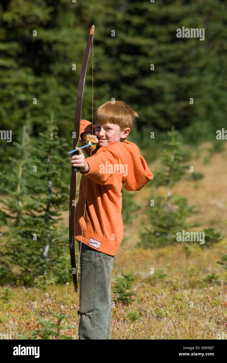 Boy with bow and arrow Stock Photo - Alamy