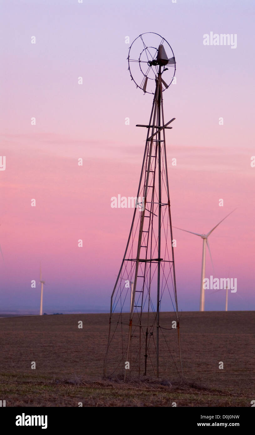 Old wind mill and modern wind turbines at the Klondike Wind Farm in ...