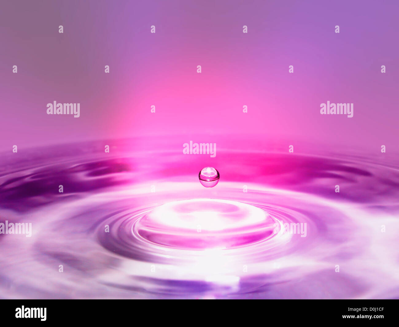 Pink Water Droplet with Ripple Stock Photo - Alamy
