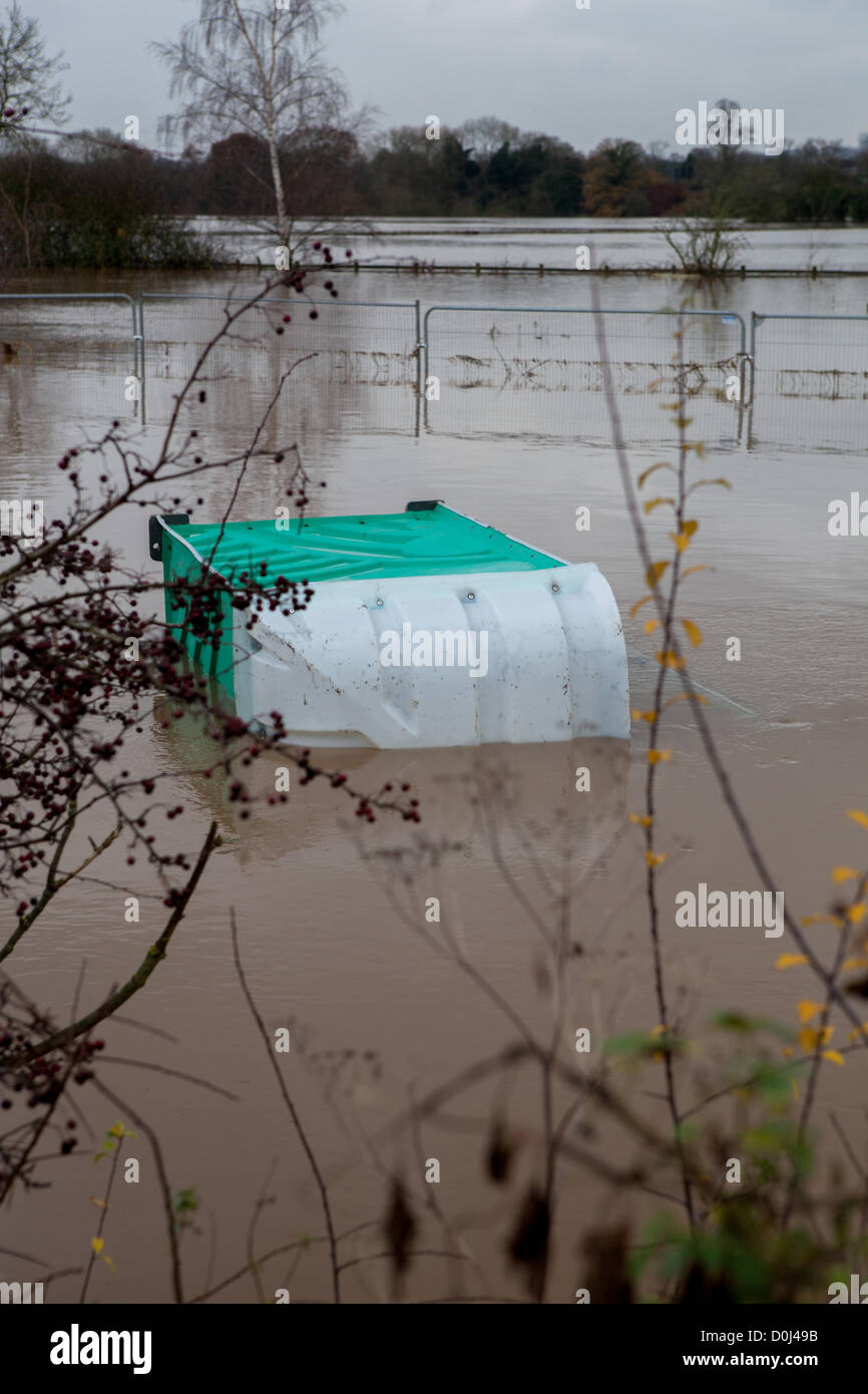Portable toilet floating in floodwater on the construction site of some ...