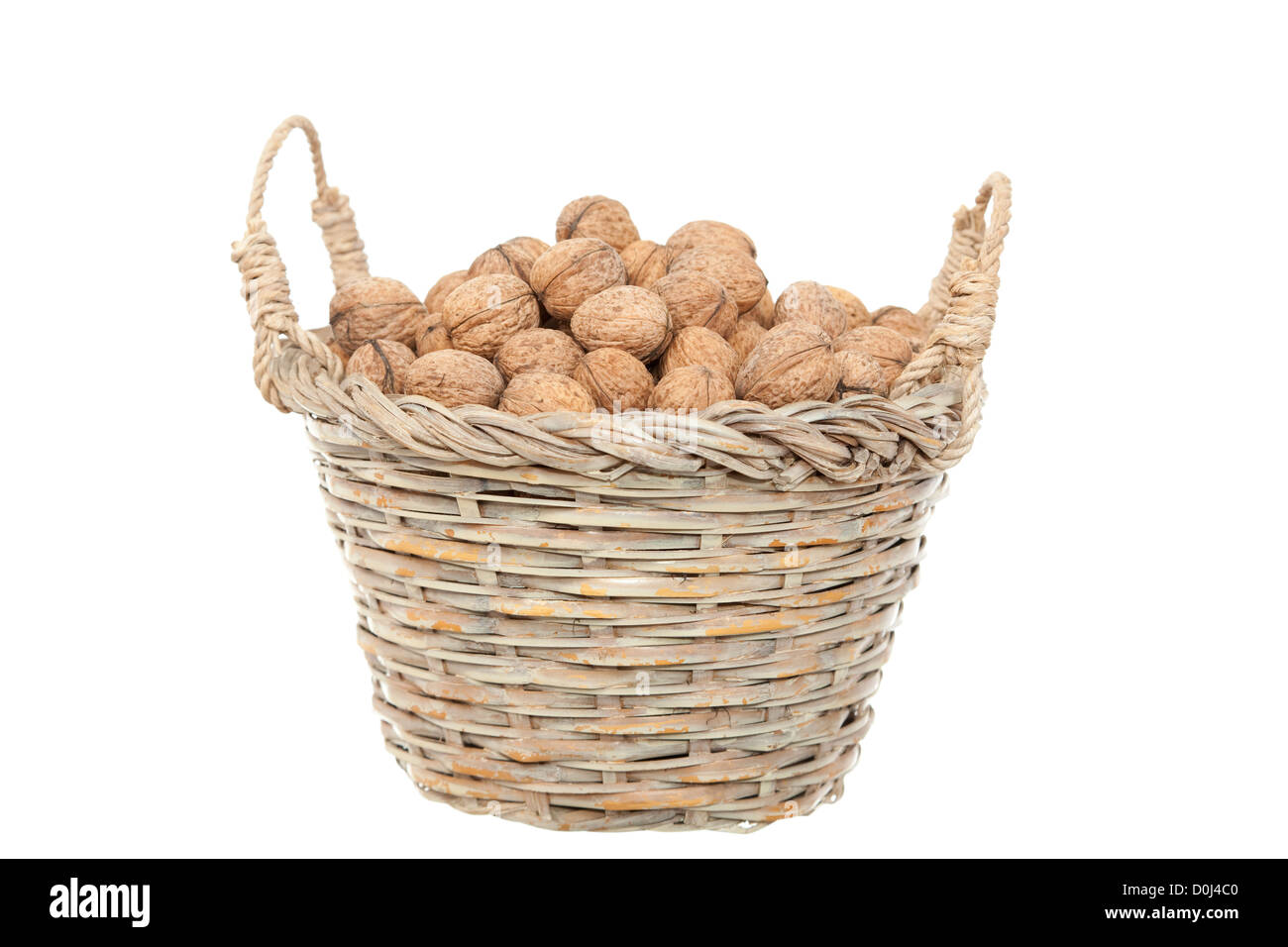 whole walnuts in big basket on white background Stock Photo - Alamy