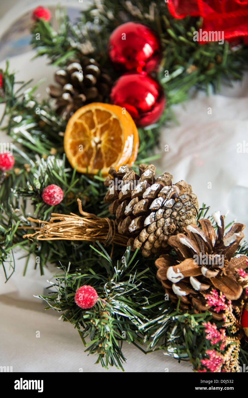 Close up of Christmas wreath decoration with pine cone and glass ...