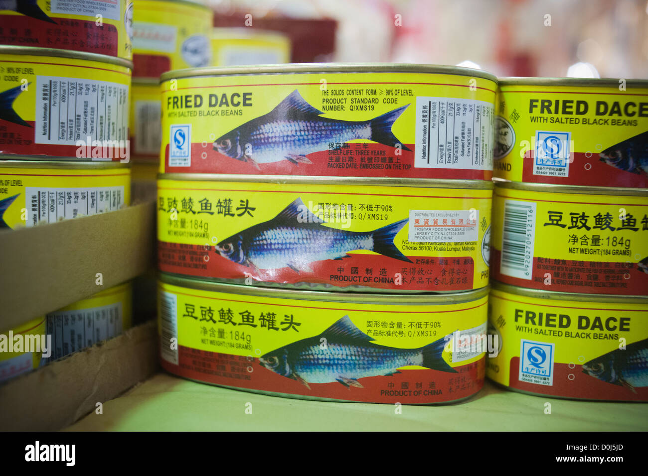Cans of fried dace in salted black beans are seen in an Asian ...