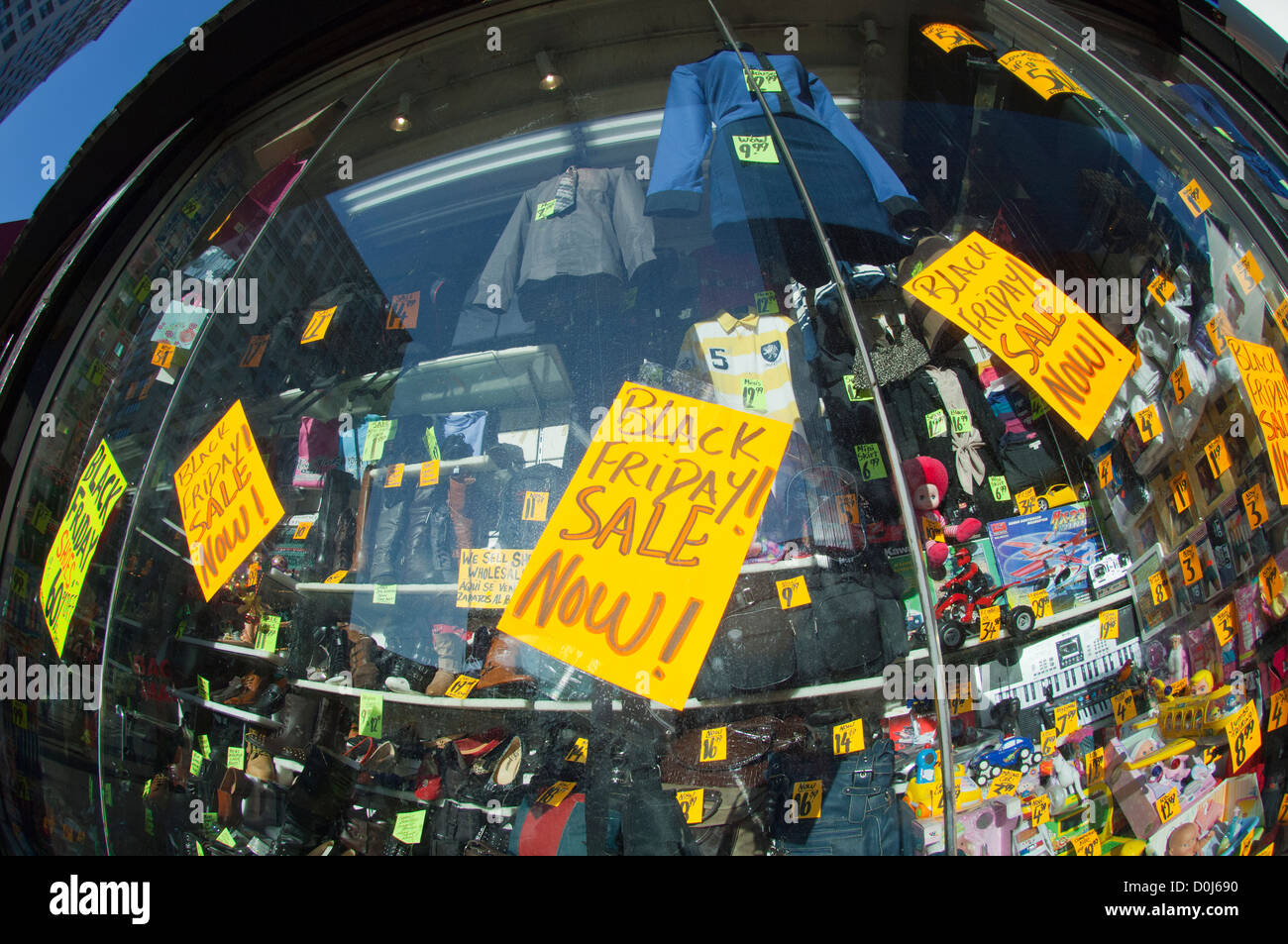 Signs in a store window say Black Friday Sale Now seen in the Herald ...