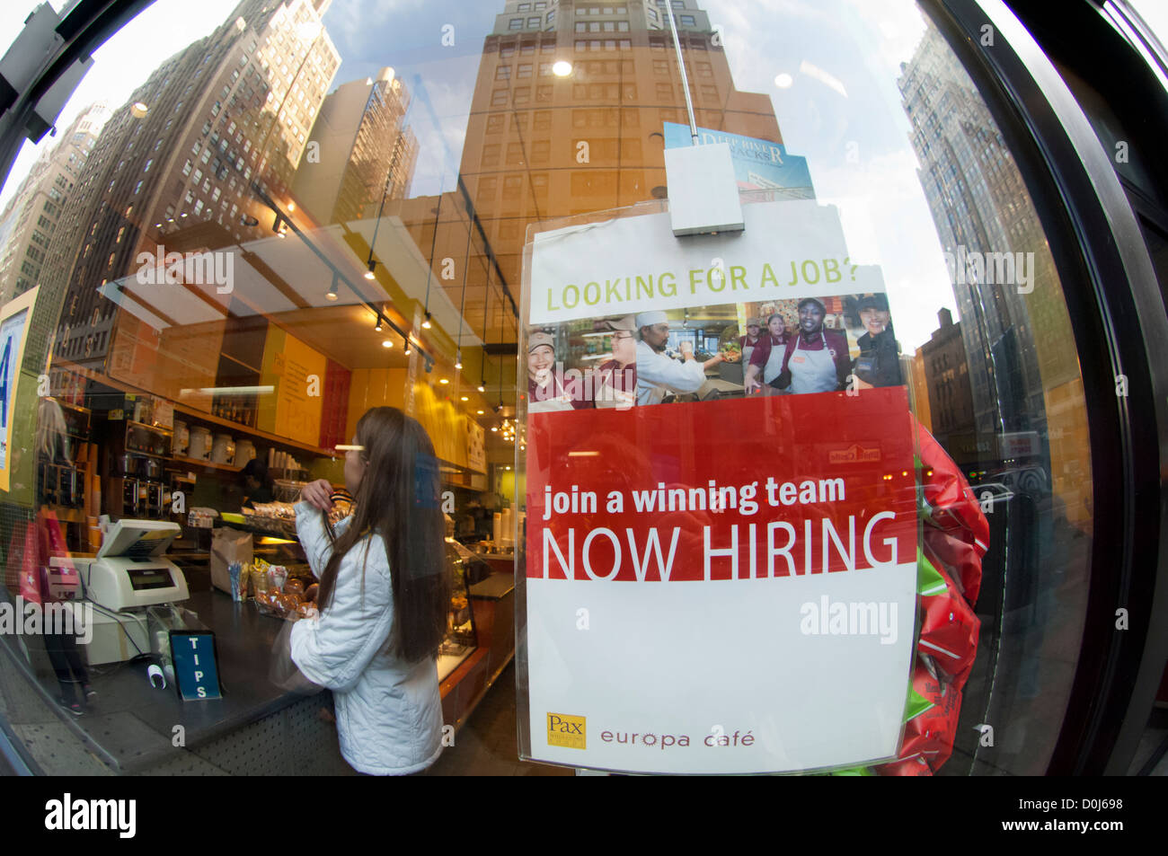 A hiring center posted in the window of a cafe in midtown in New York ...