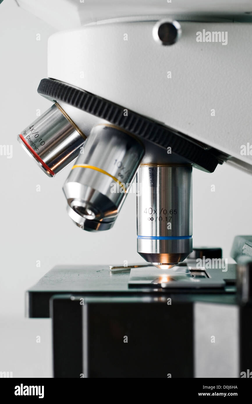 side of microscope on gray Stock Photo - Alamy