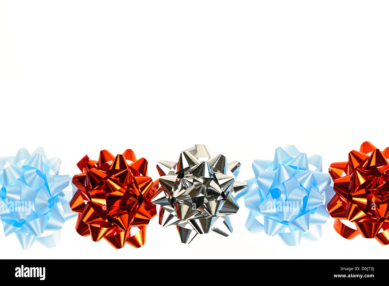 Row of multicolored gift wrapping bows isolated on white background ...