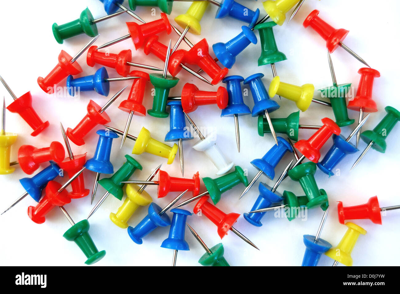 Colorful push pins on white background Stock Photo - Alamy