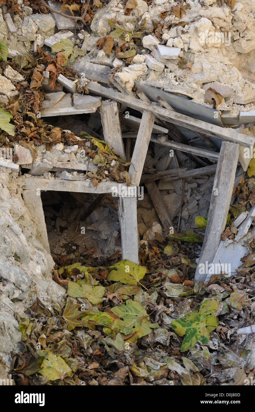 Crooked wooden underpin crumbling under the weight of rubble pile Stock ...