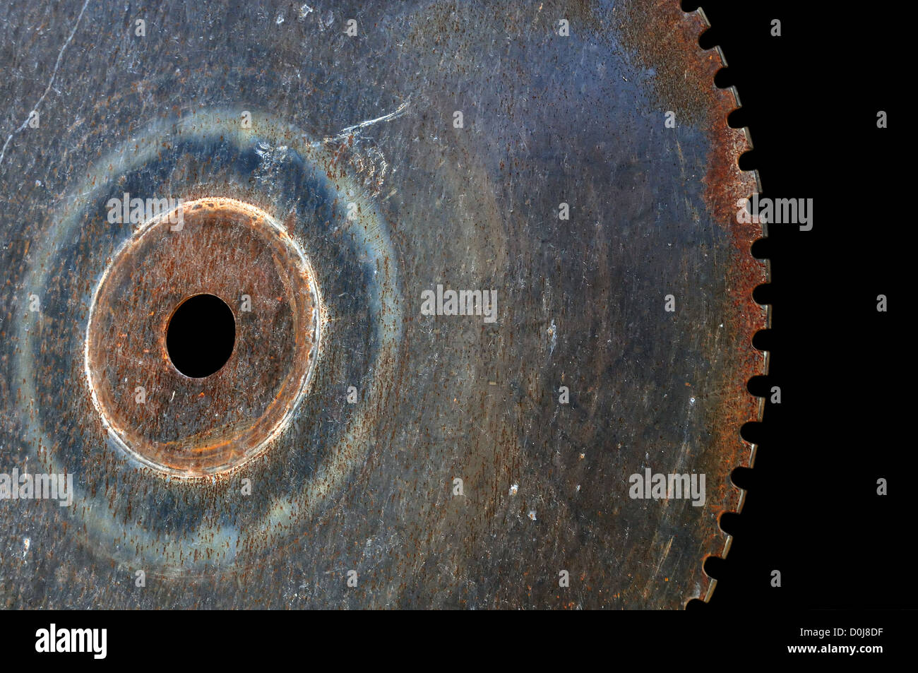 Rusty saw blade cutting wheel. Vintage industrial equipment on black ...