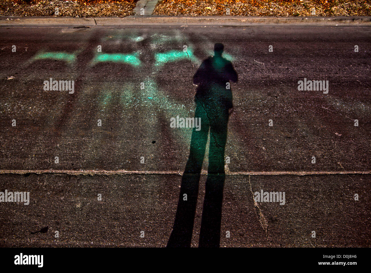 Shadow of man on street Stock Photo - Alamy