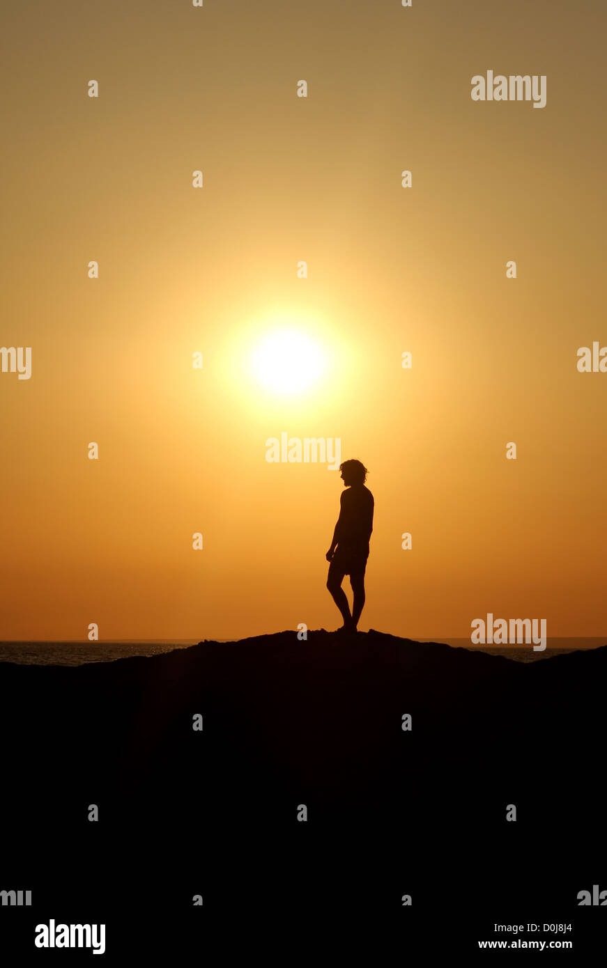 He's truly enjoying being alone with this beautiful dusk on the beach ...
