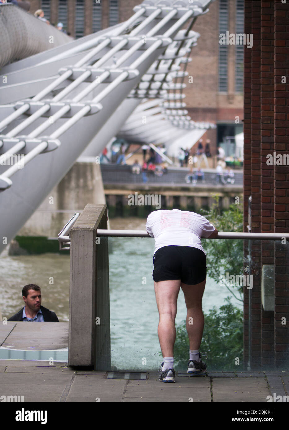 Exhausted jogger with missing head at the Millennium Bridge in London ...
