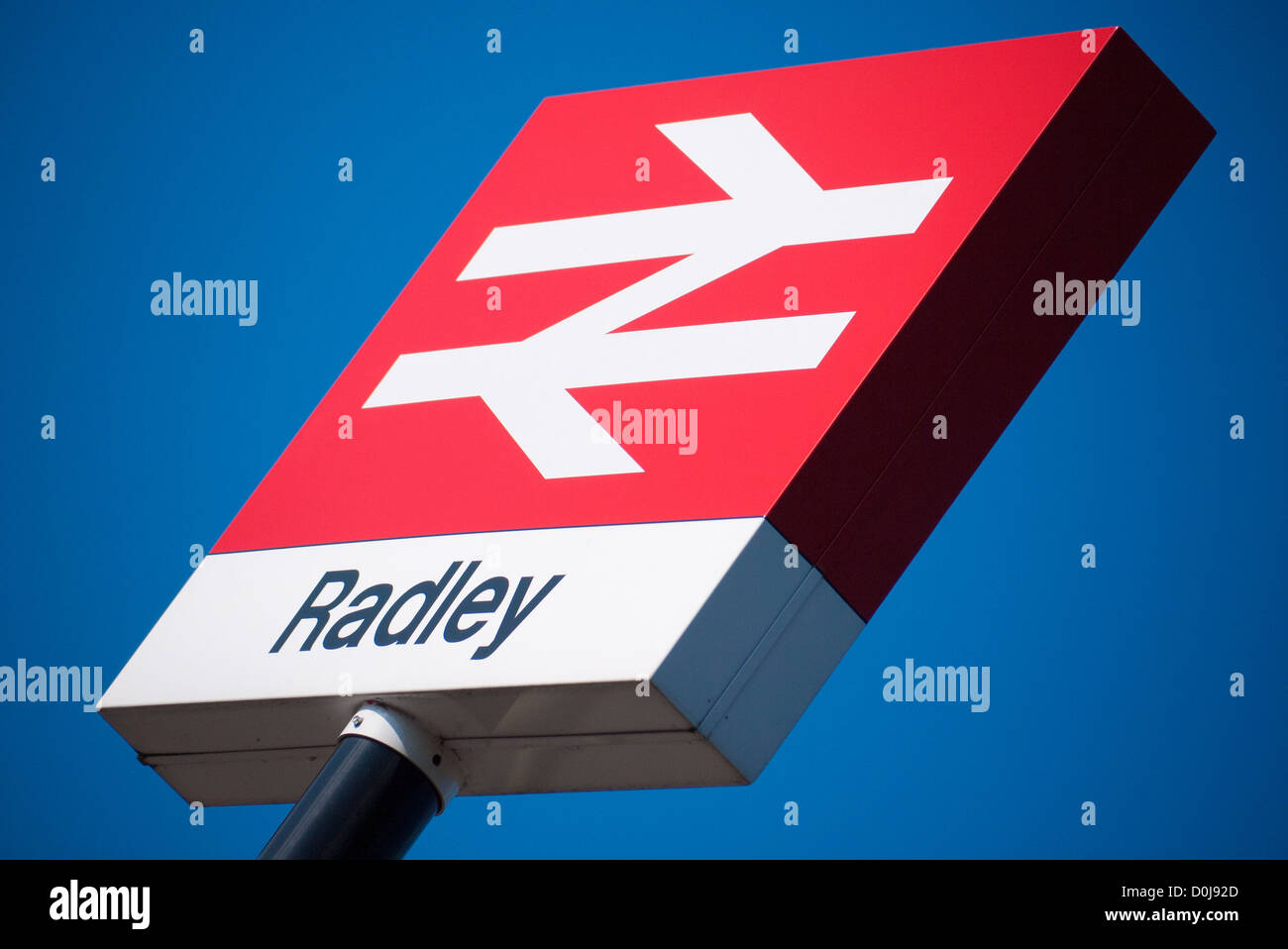 Radley train station sign against a blue sky Stock Photo - Alamy