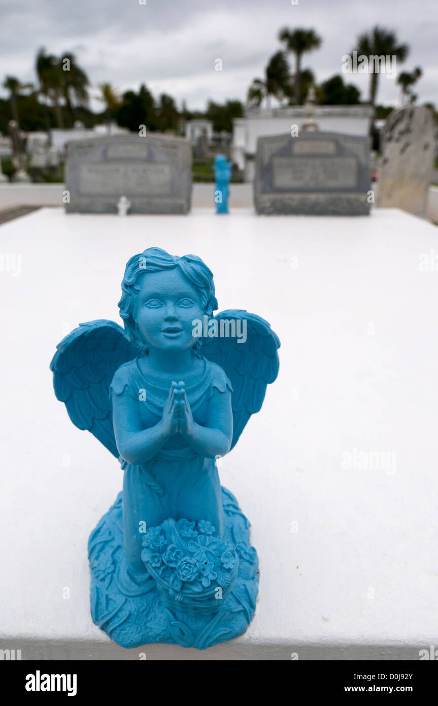 Plastic angel statue adorns above ground grave at the historic Key West ...