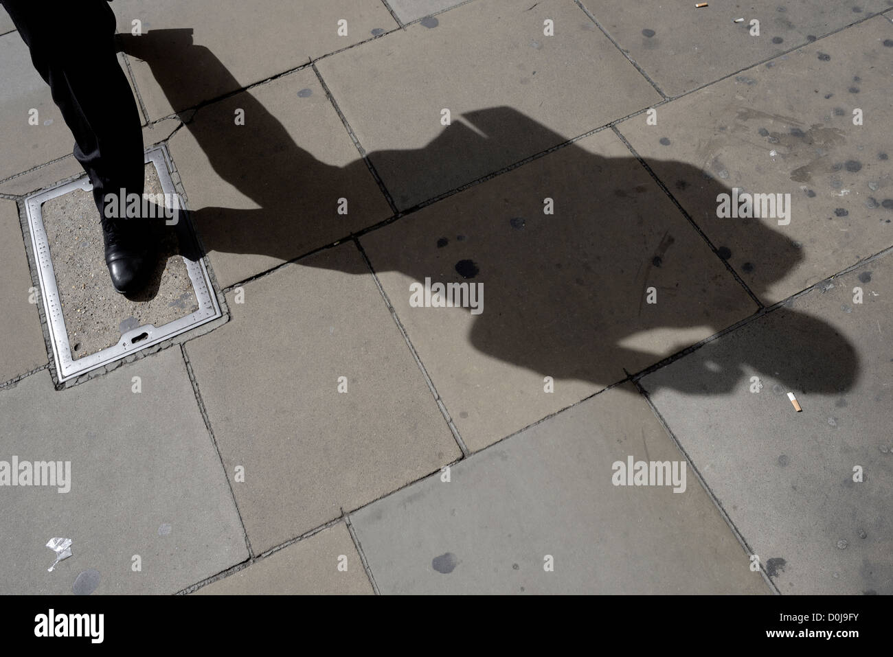 city of london man walks shadow mobile phone Stock Photo - Alamy