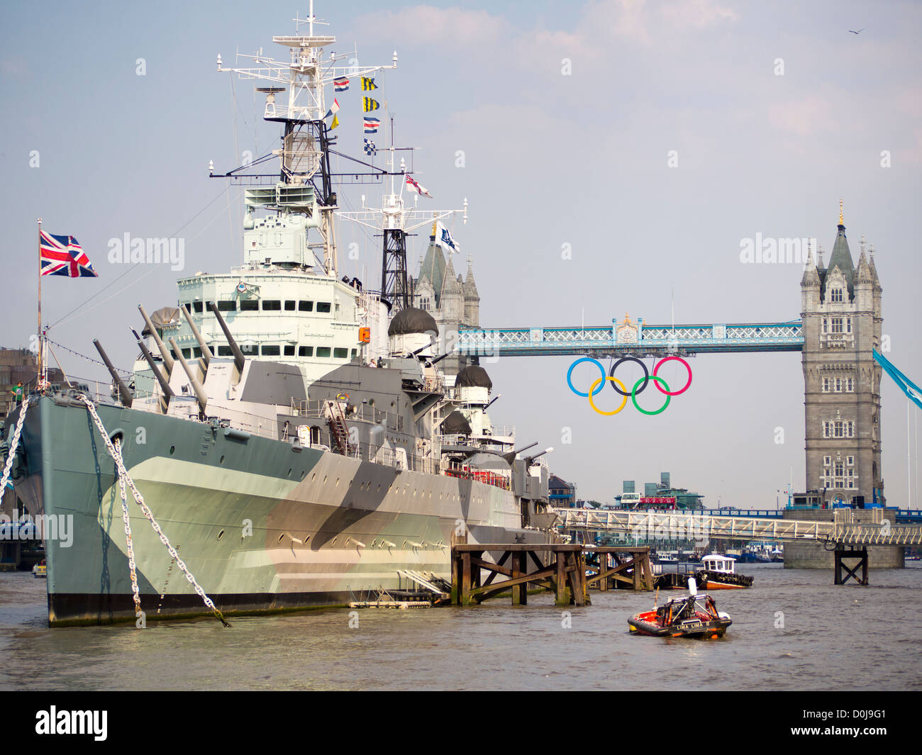 HMS Belfast and Tower Bridge with the Olympic rings Stock Photo - Alamy