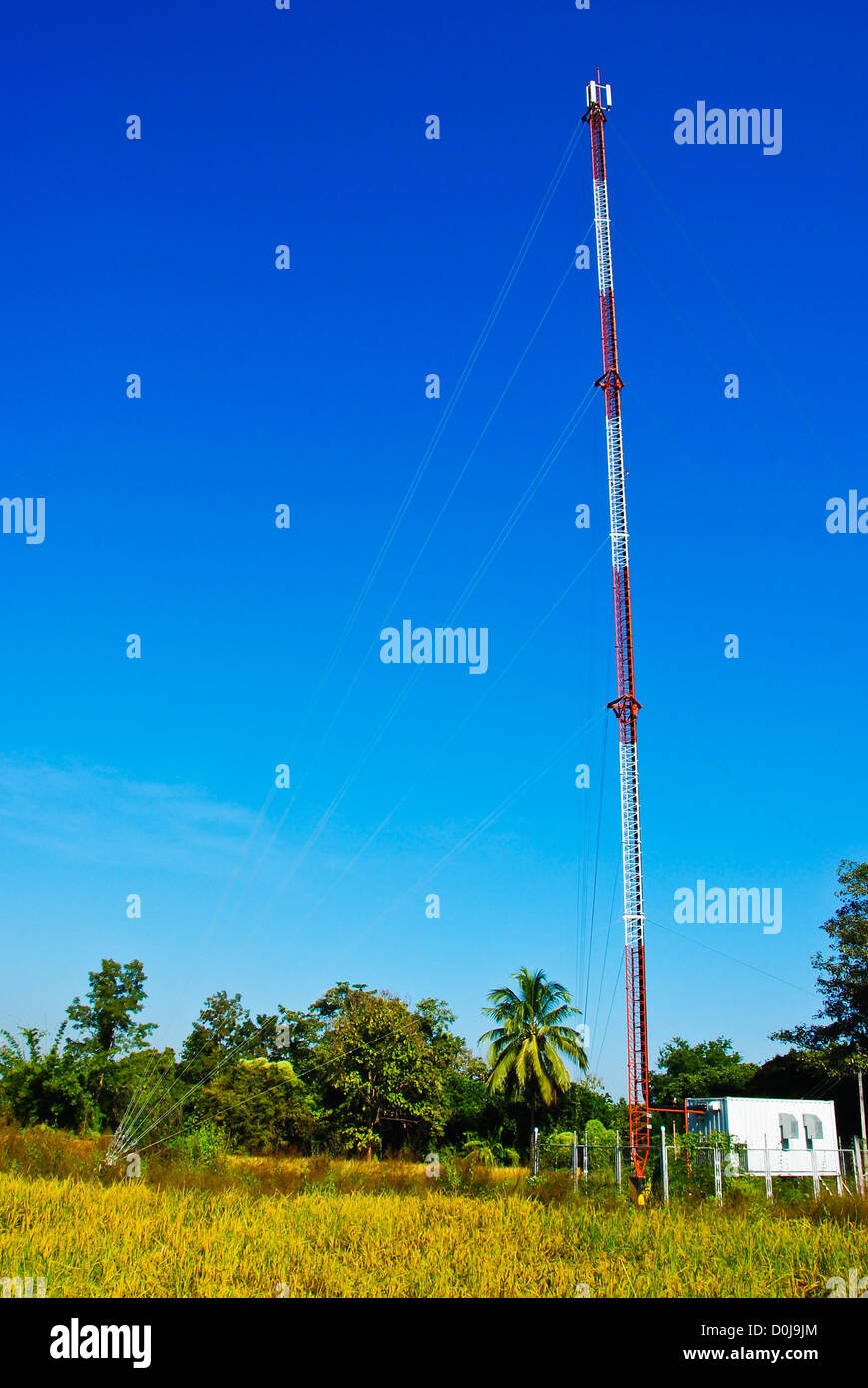 Telecoms tower and blue sky Stock Photo - Alamy