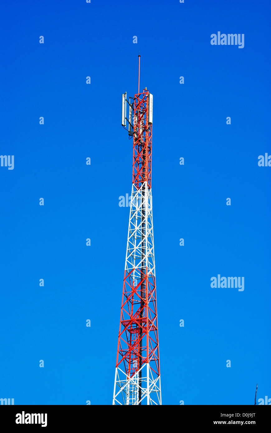Telecoms tower and blue sky Stock Photo - Alamy
