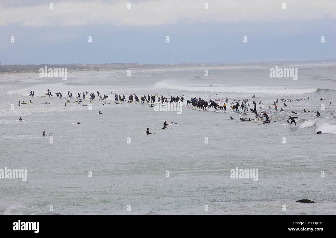 Surfers ride a wave at the annual Earthwave event, where the ...