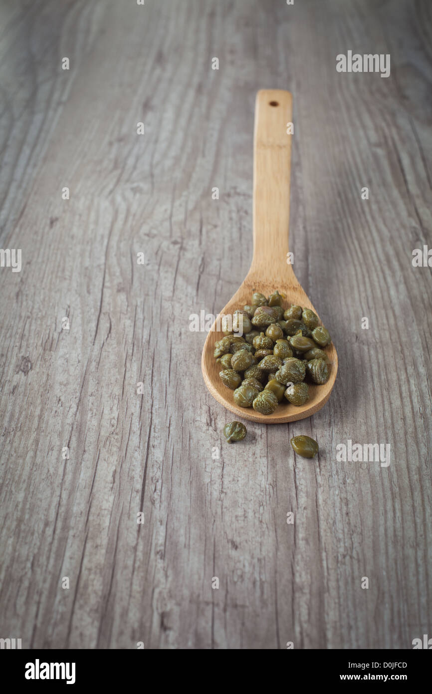 Bunch of fresh capers on a wooden spoon Stock Photo - Alamy