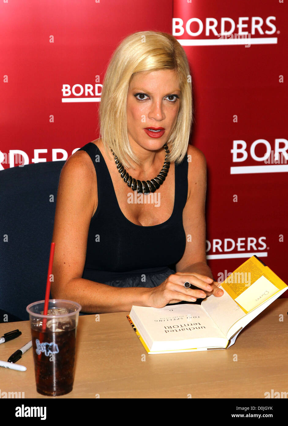 Tori Spelling signs copies of her book 'Uncharted Territori' at Borders ...